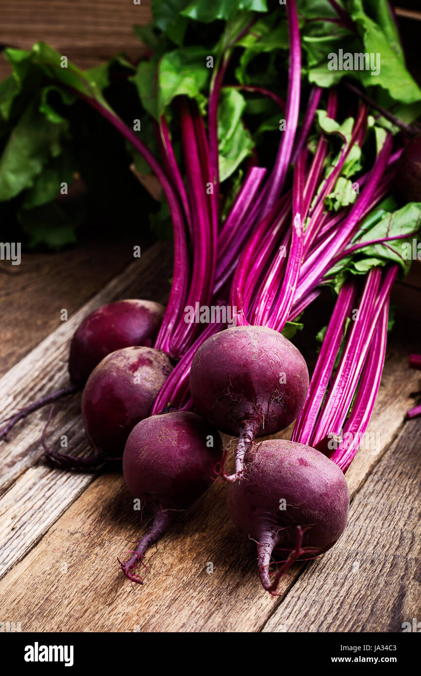 Organic farm. Fresh beetroot in crate, vegetables on rustic wooden ...