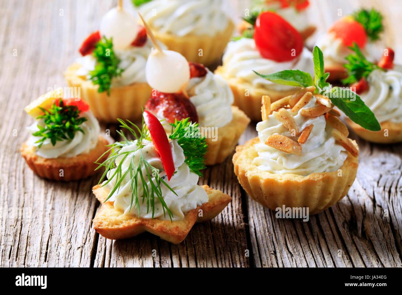 Variety of pastry-based canapes with various toppings Stock Photo - Alamy