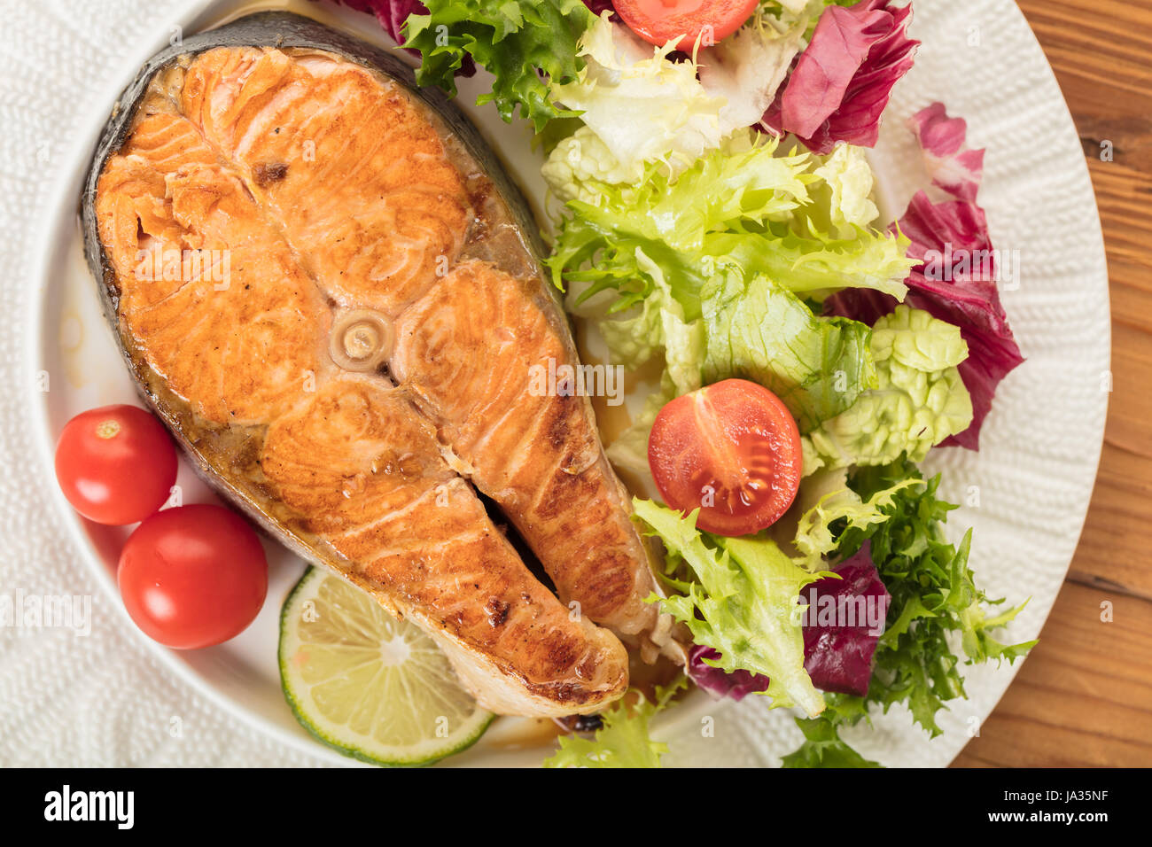 cooked steak salmon with vegetables top view Stock Photo - Alamy