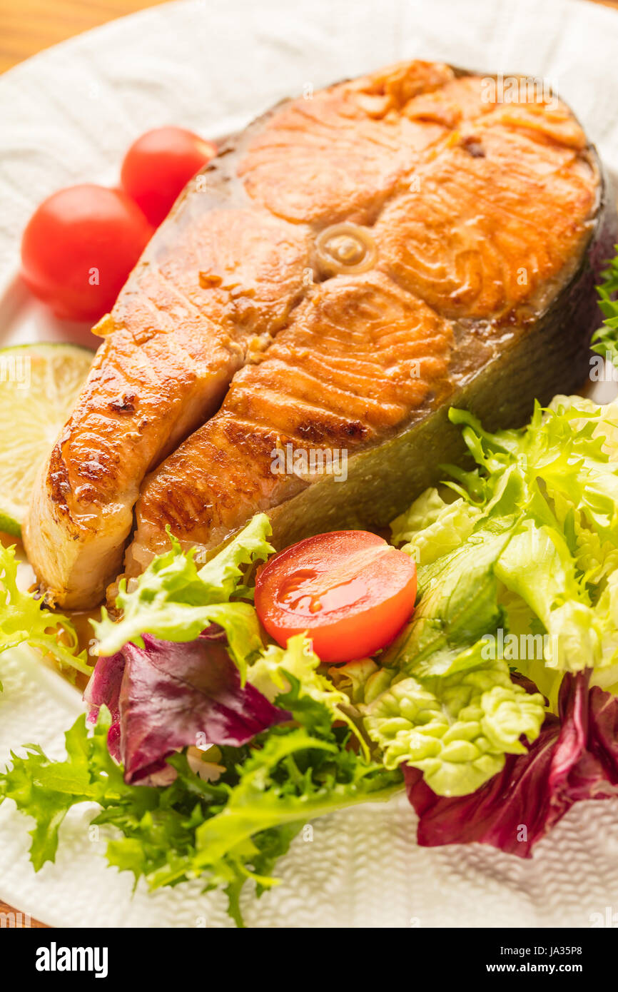 cooked steak red fish with vegetables closeup Stock Photo - Alamy