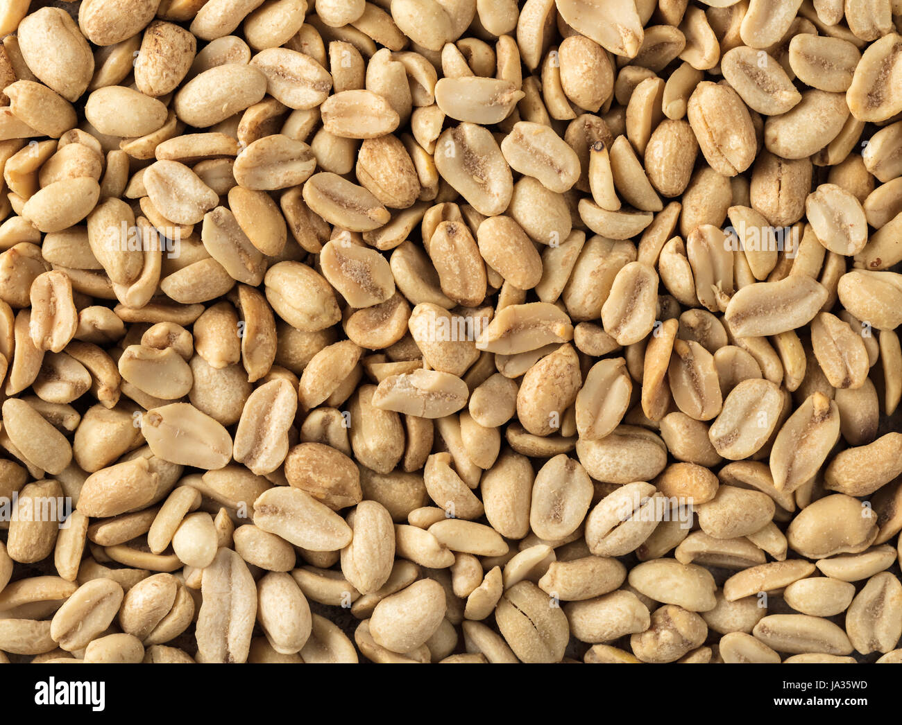 abstract background texture of roasted peanuts closeup Stock Photo - Alamy