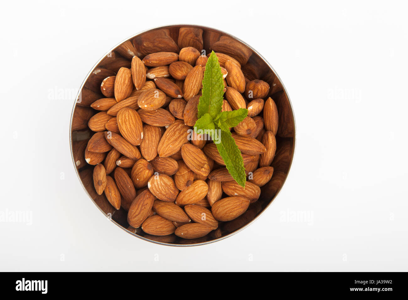 Many almonds isolated on white background Stock Photo - Alamy