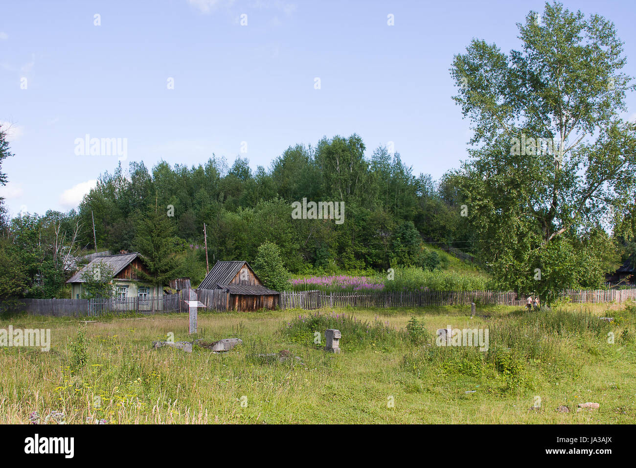 wooden houses are in a village Stock Photo - Alamy