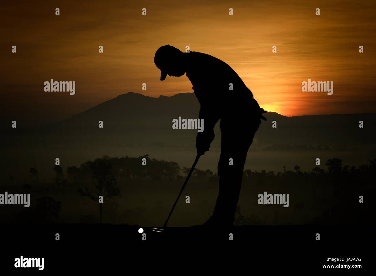silhouette of golfers hit sweeping and keep golf course in the summer ...
