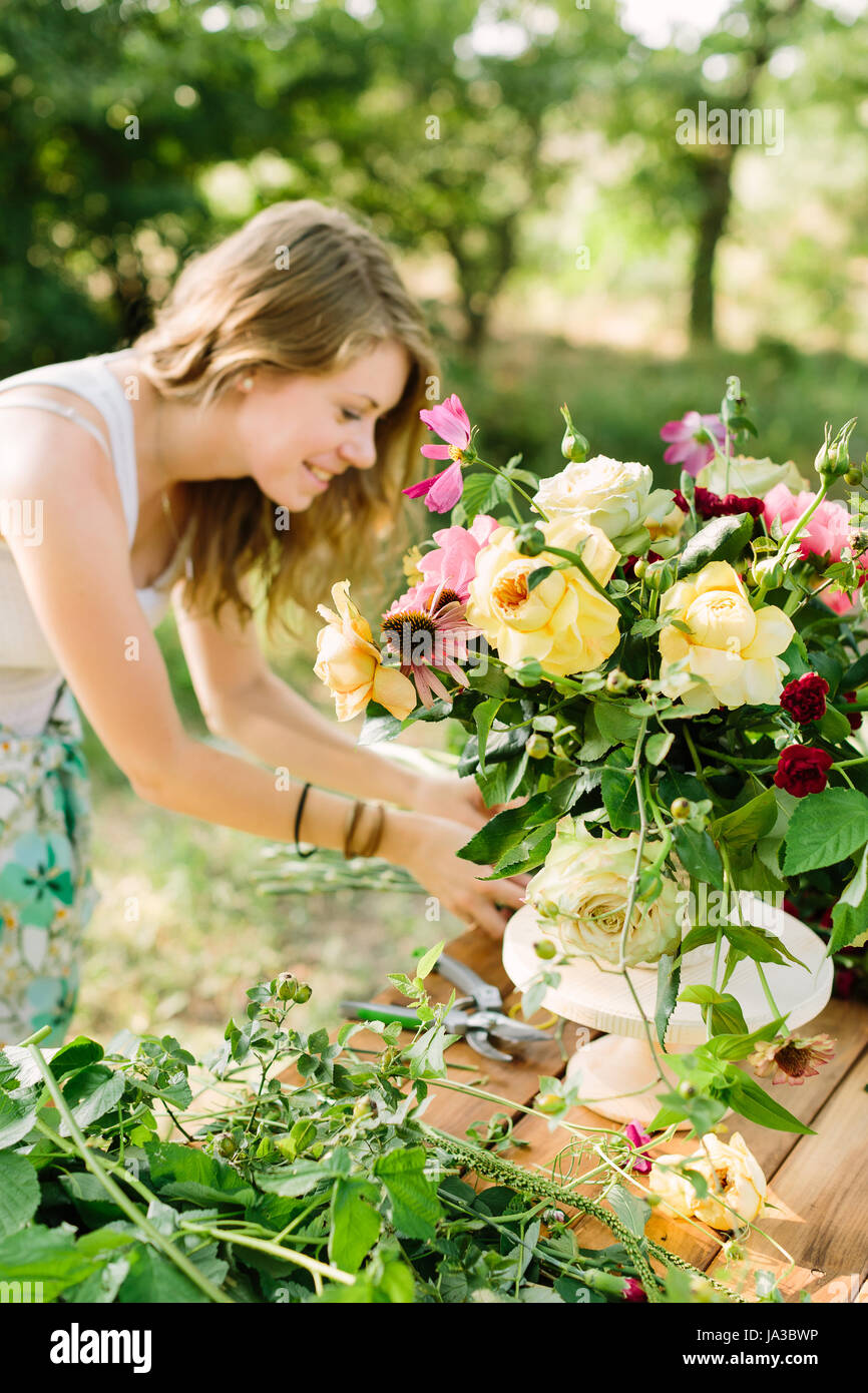 bouquet, people and floral arrangement concept - woman with beautiful ...