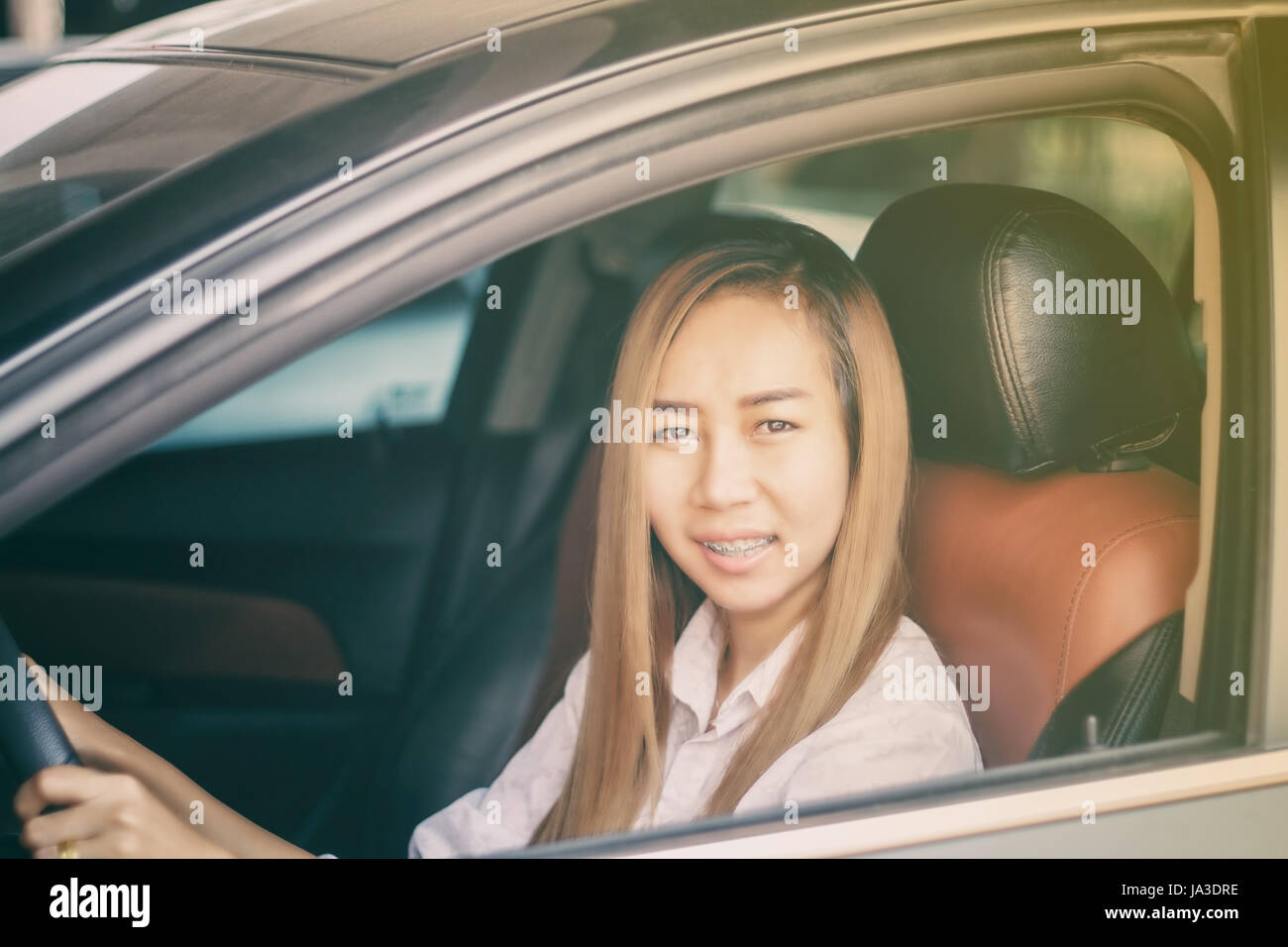 Asian women are driving cars on the road Stock Photo - Alamy