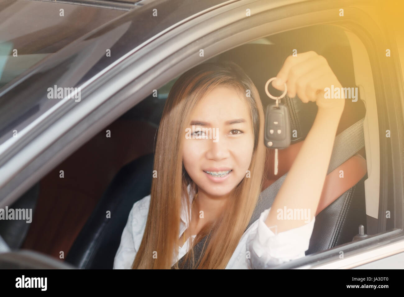 Asian women are driving cars on the road Stock Photo - Alamy
