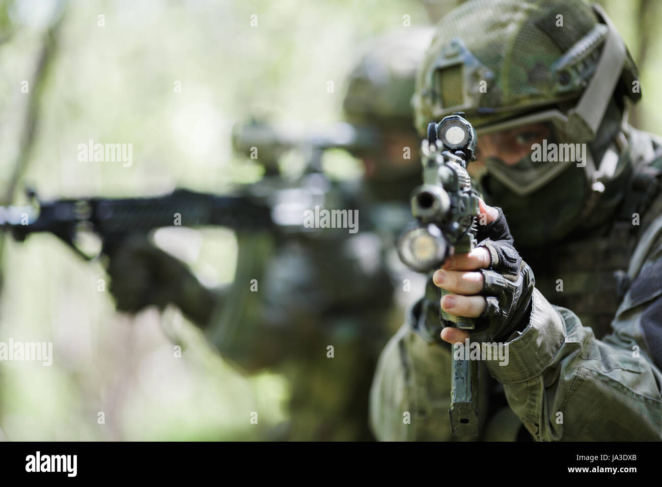 Portrait of soldier with weapons on reconnaissance in forest Stock ...
