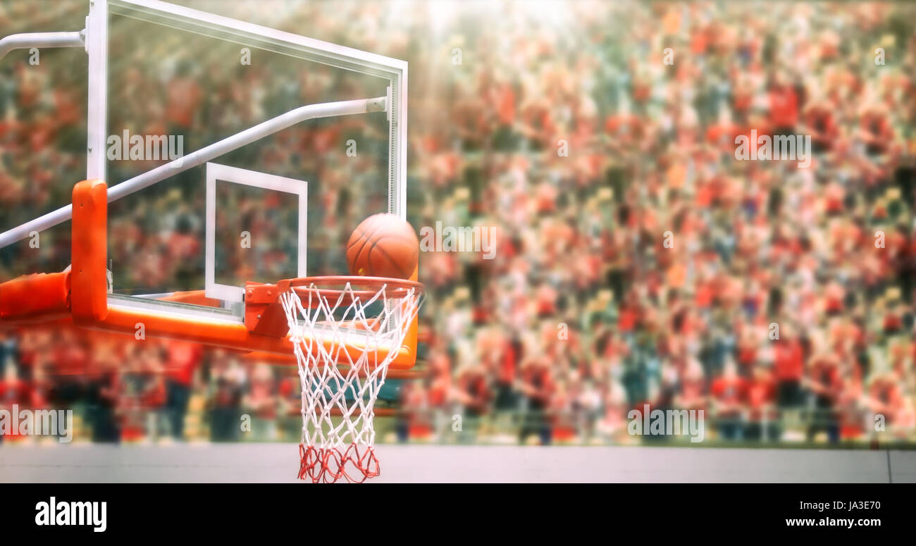 Basketball going through net and scoring during match ,Blurry and soft ...