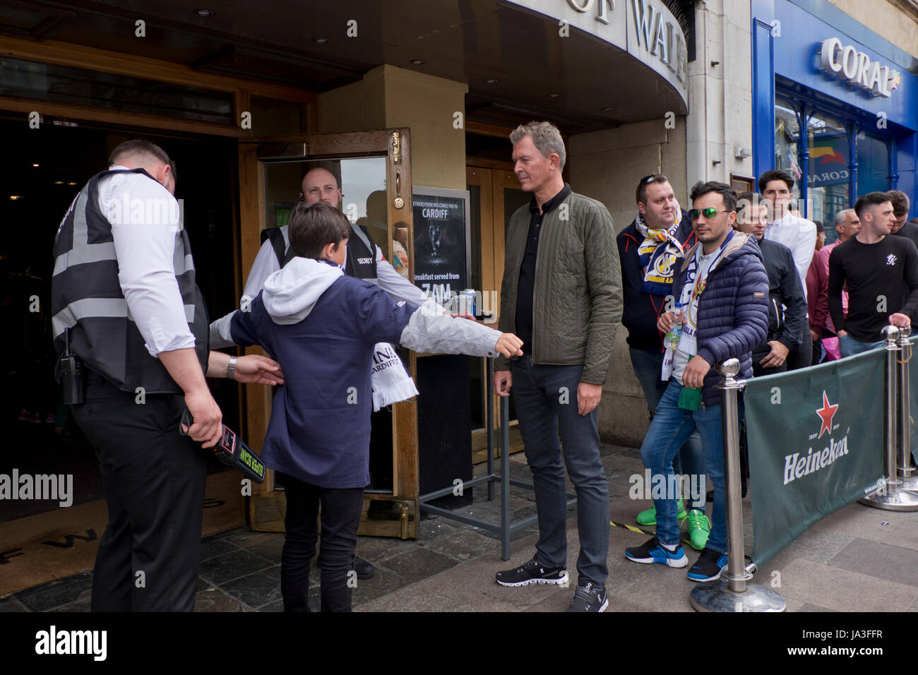 Private security staff searching public entering pub before the UEFA ...