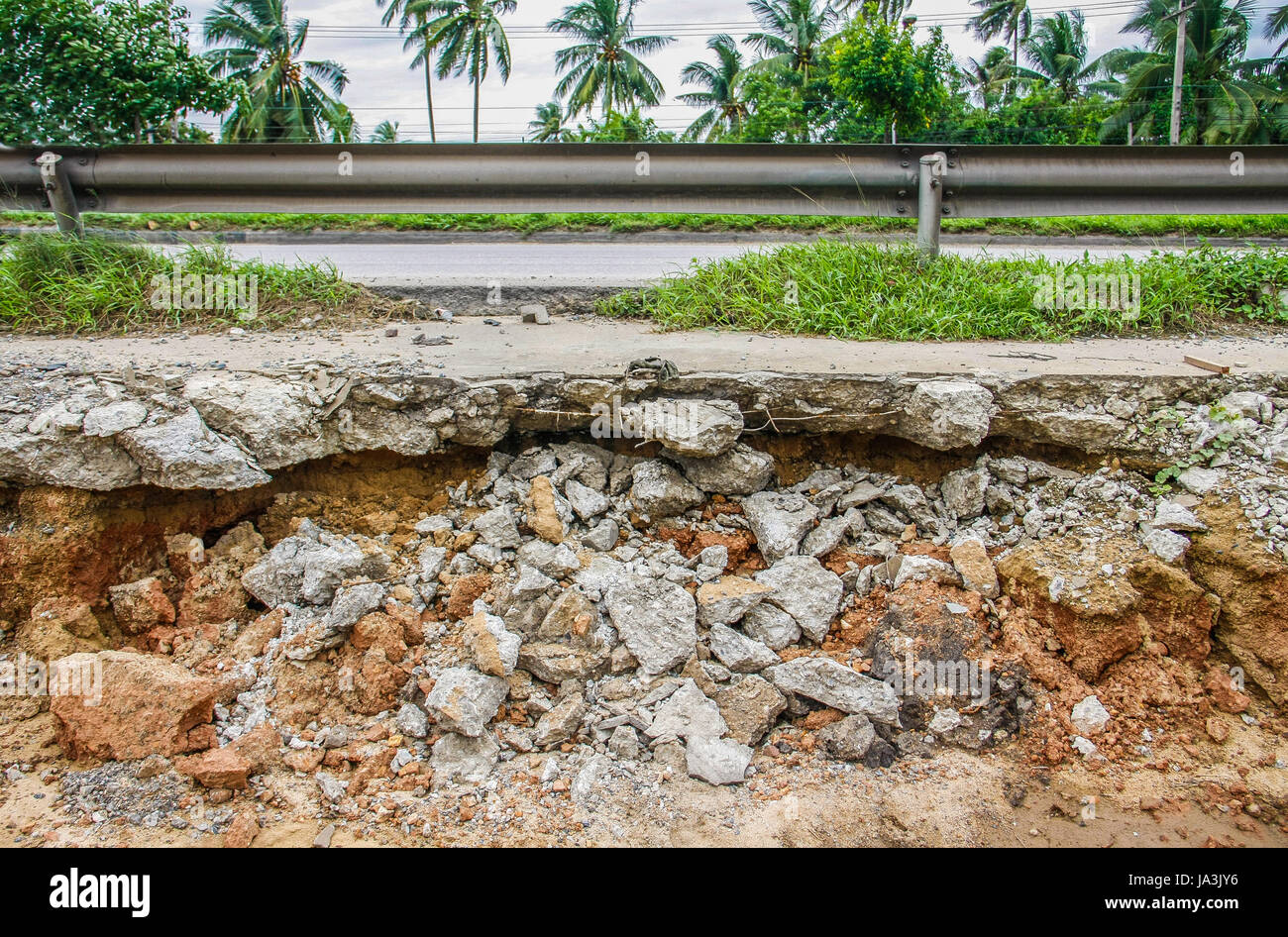 Cracked Concrete road with scour trace Stock Photo - Alamy