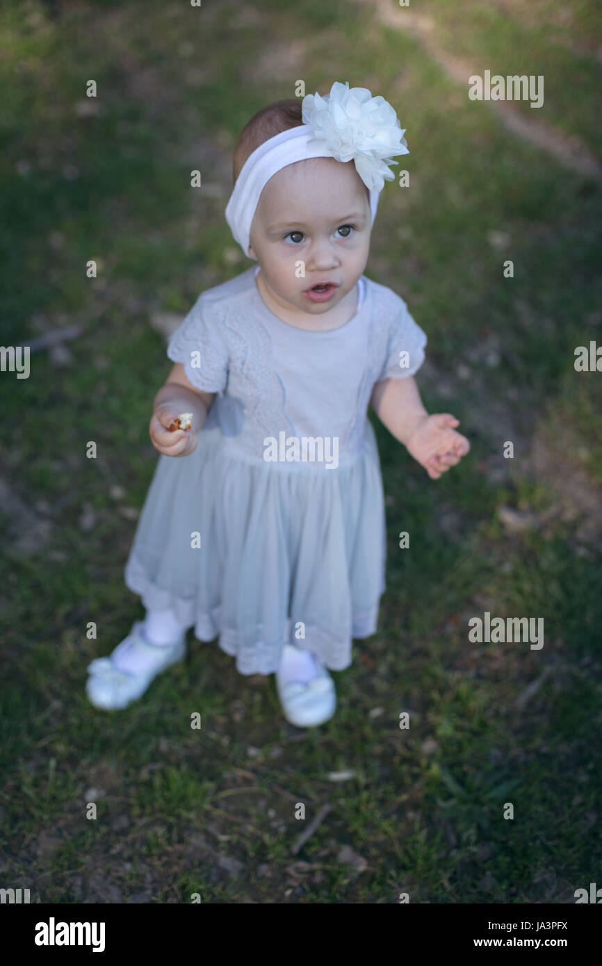 Cute baby girl playing in nature Stock Photo - Alamy