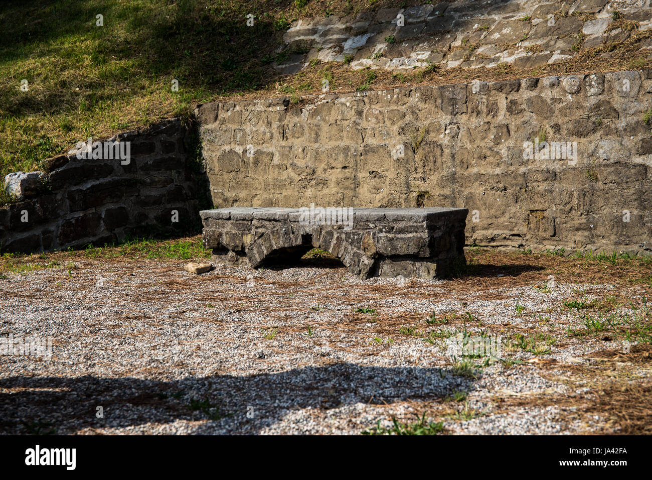 Stone medieval bench near wall Stock Photo - Alamy