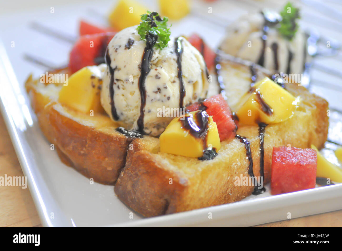 toast with ice cream and fruit topping dish Stock Photo - Alamy
