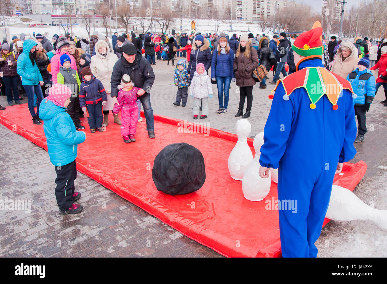 PERM, RUSSIA - March 13, 2016: Children playing skittles at the ...