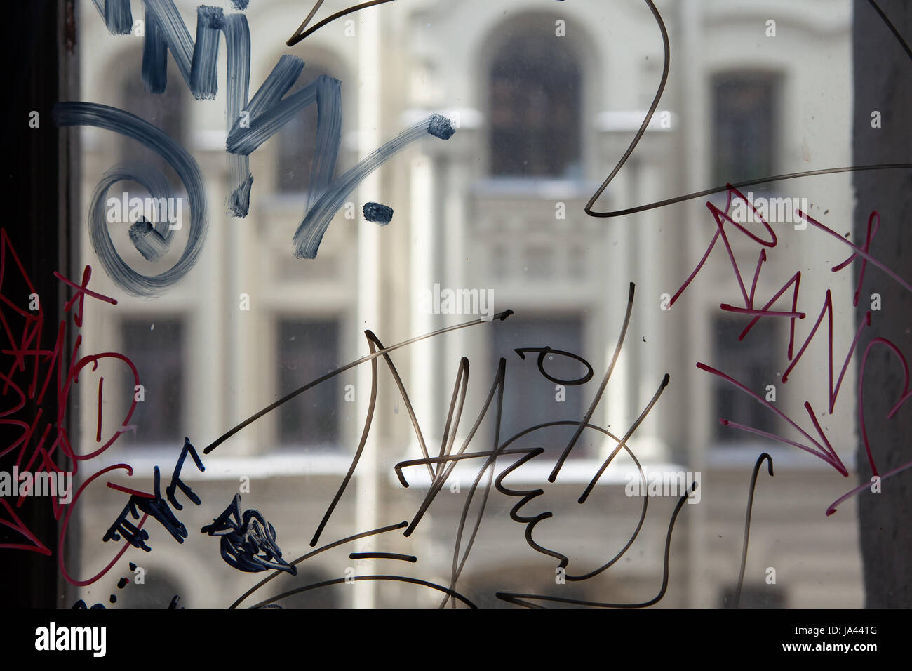 Vandal graffiti on the window of a house Stock Photo - Alamy