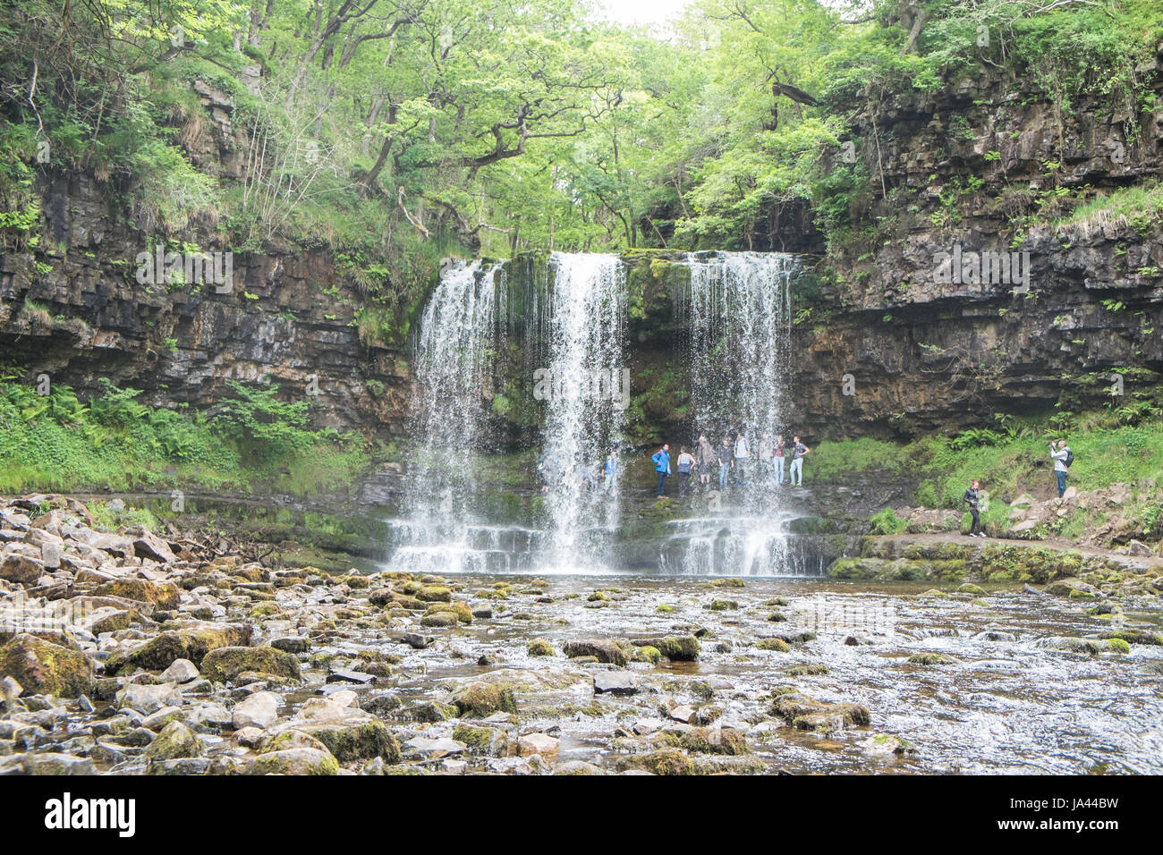 People,hiking,walk,behind,beneath,waterfall,Sgwd yr Eira,Waterfall of ...