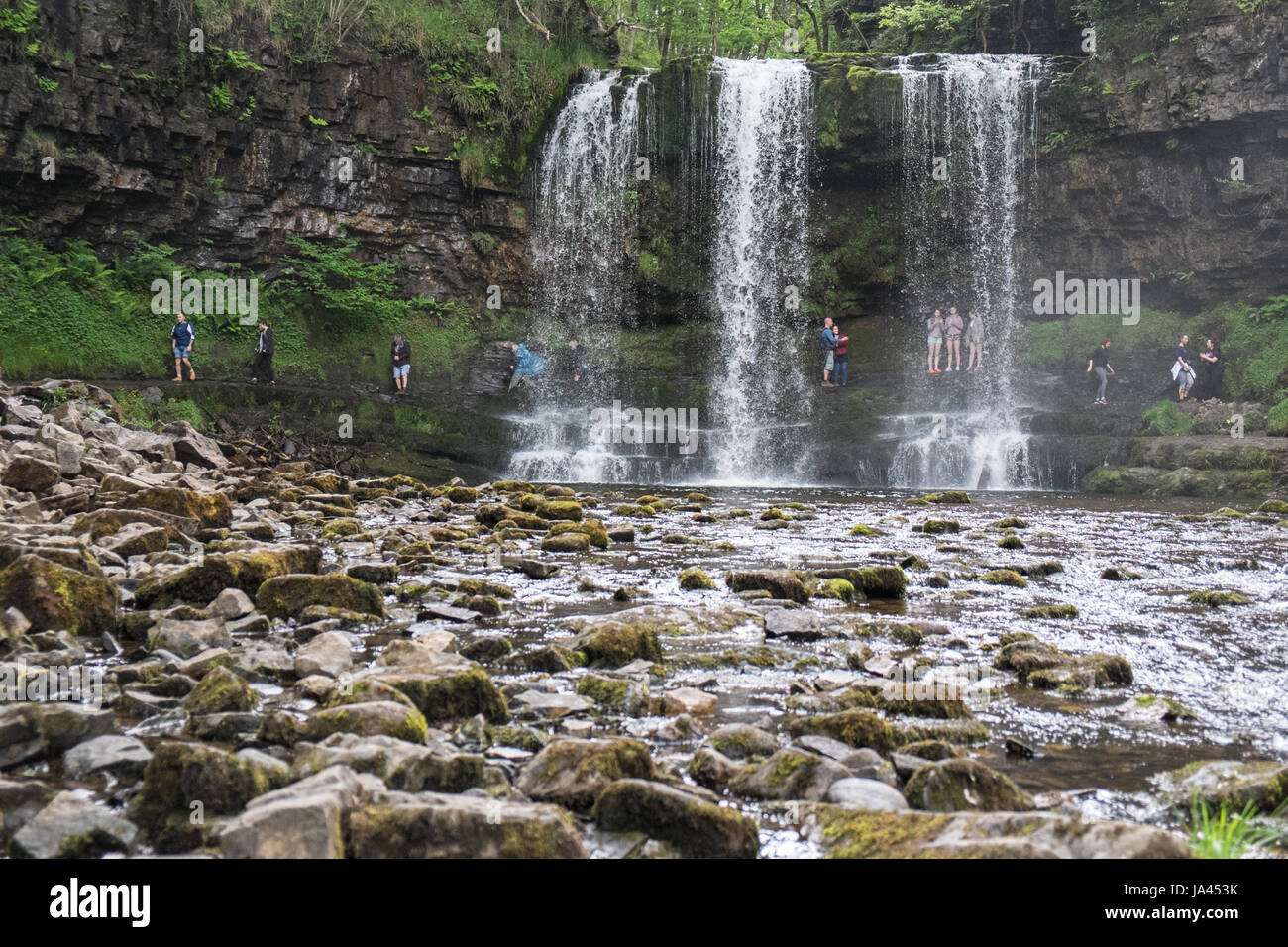 People,hiking,walk,behind,beneath,waterfall,Sgwd yr Eira,Waterfall of ...