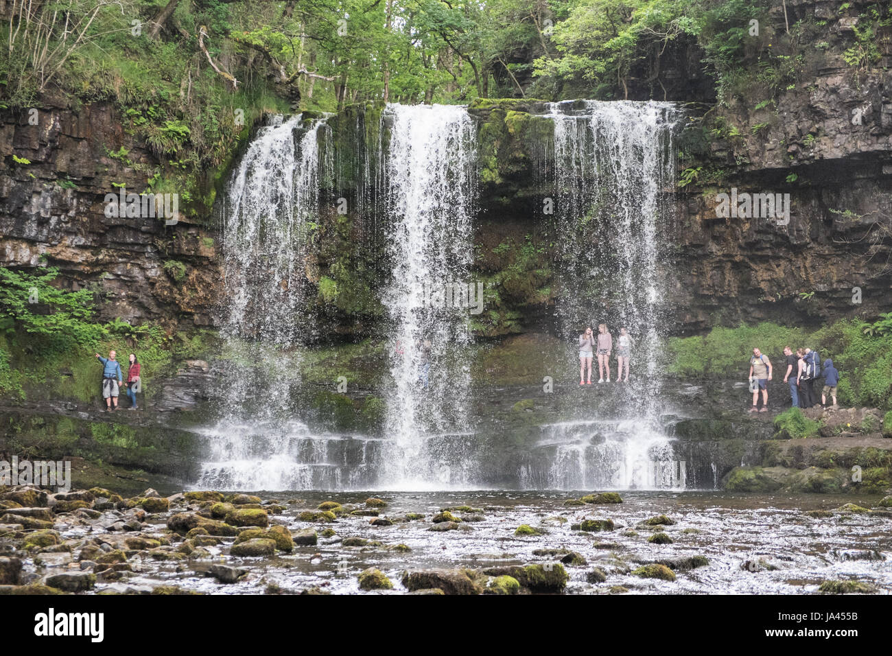 People,hiking,walk,behind,beneath,waterfall,Sgwd yr Eira,Waterfall of ...
