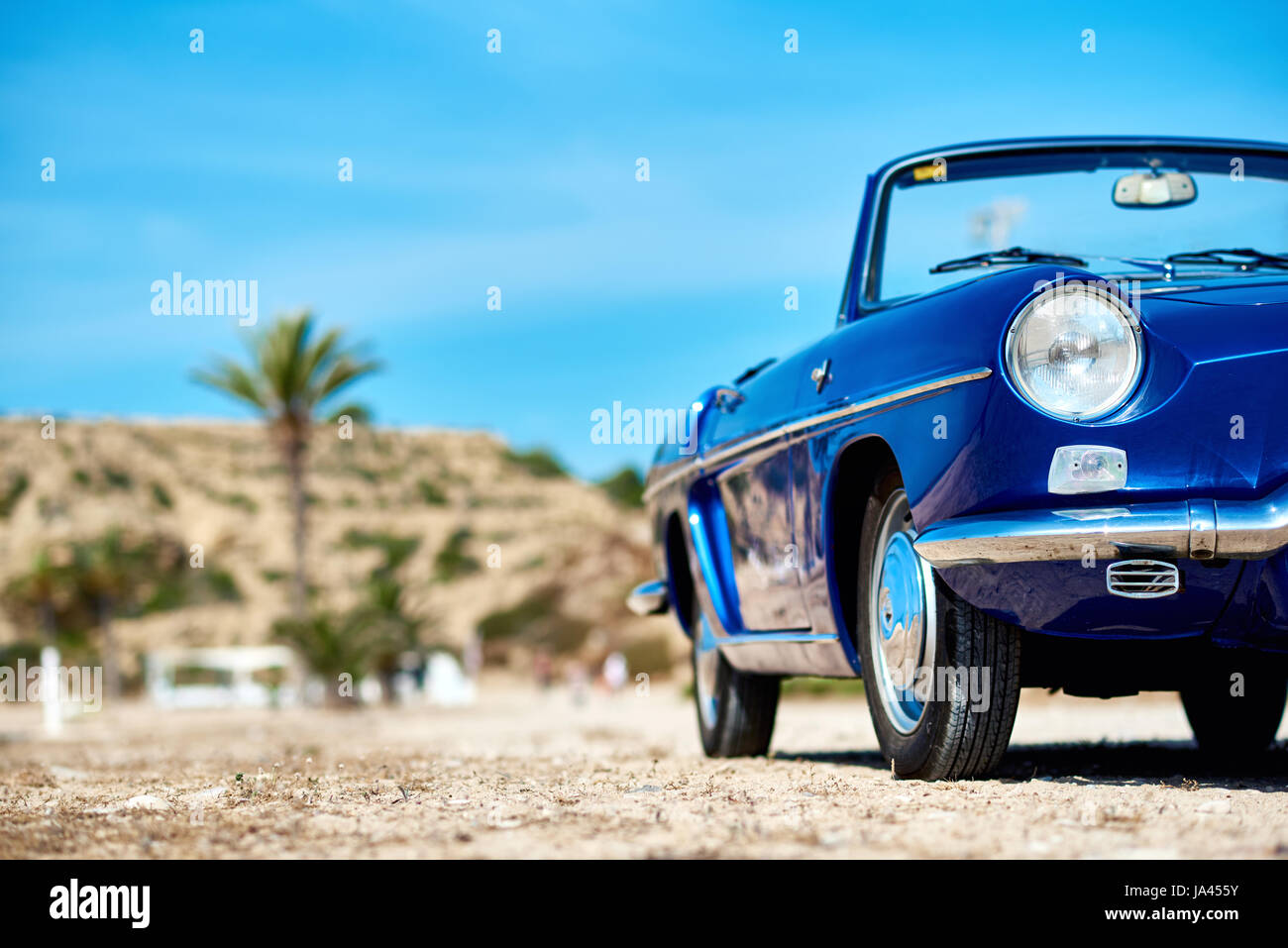 Retro cabriolet car on the beach near the turquoise sea. Idyllic ...