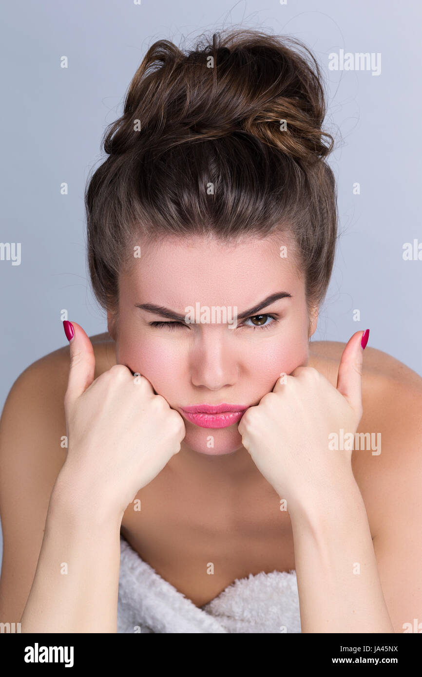 Woman blowing cheeks hi-res stock photography and images - Alamy