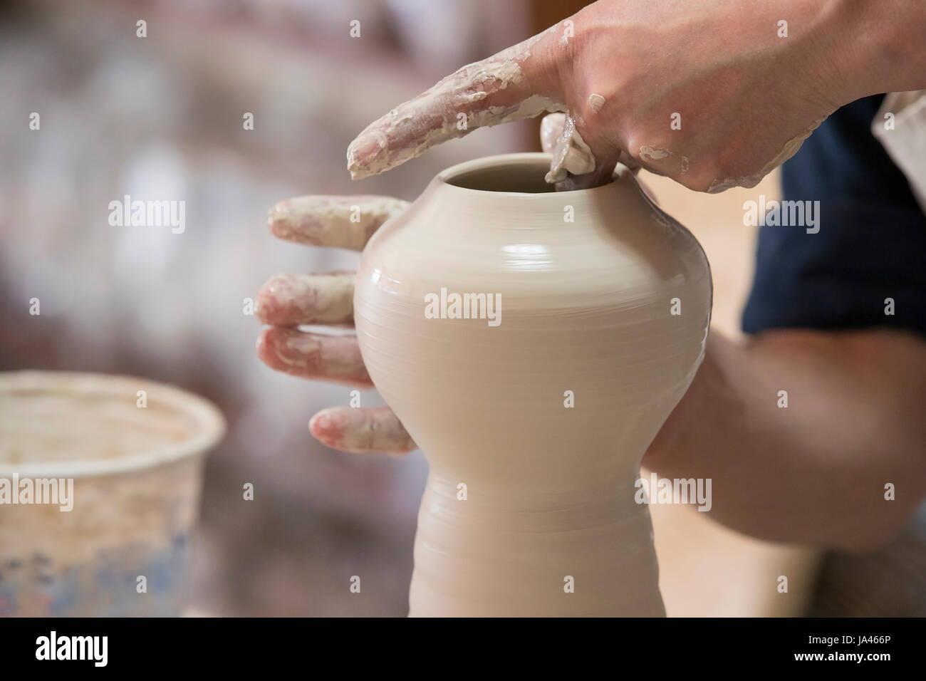Potter makes pottery handmade in the workshop Stock Photo - Alamy