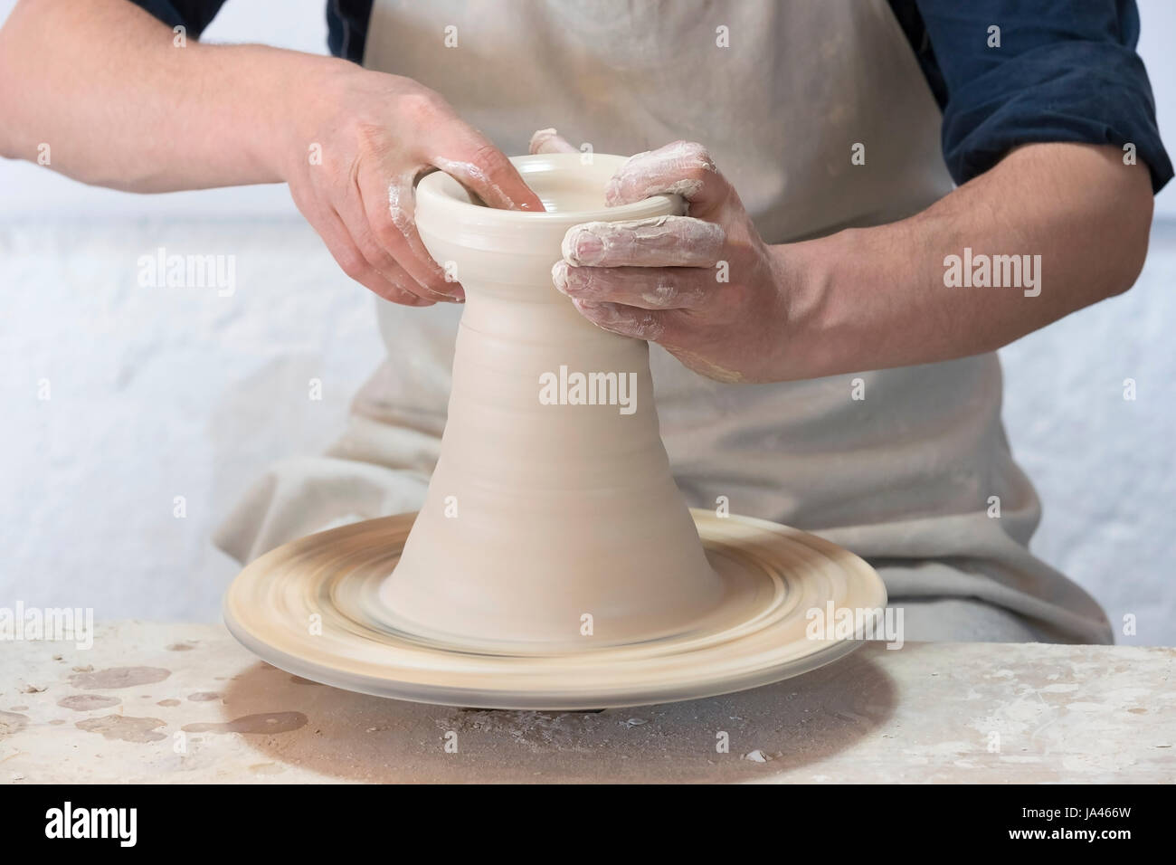 Potter makes pottery handmade in the workshop Stock Photo - Alamy
