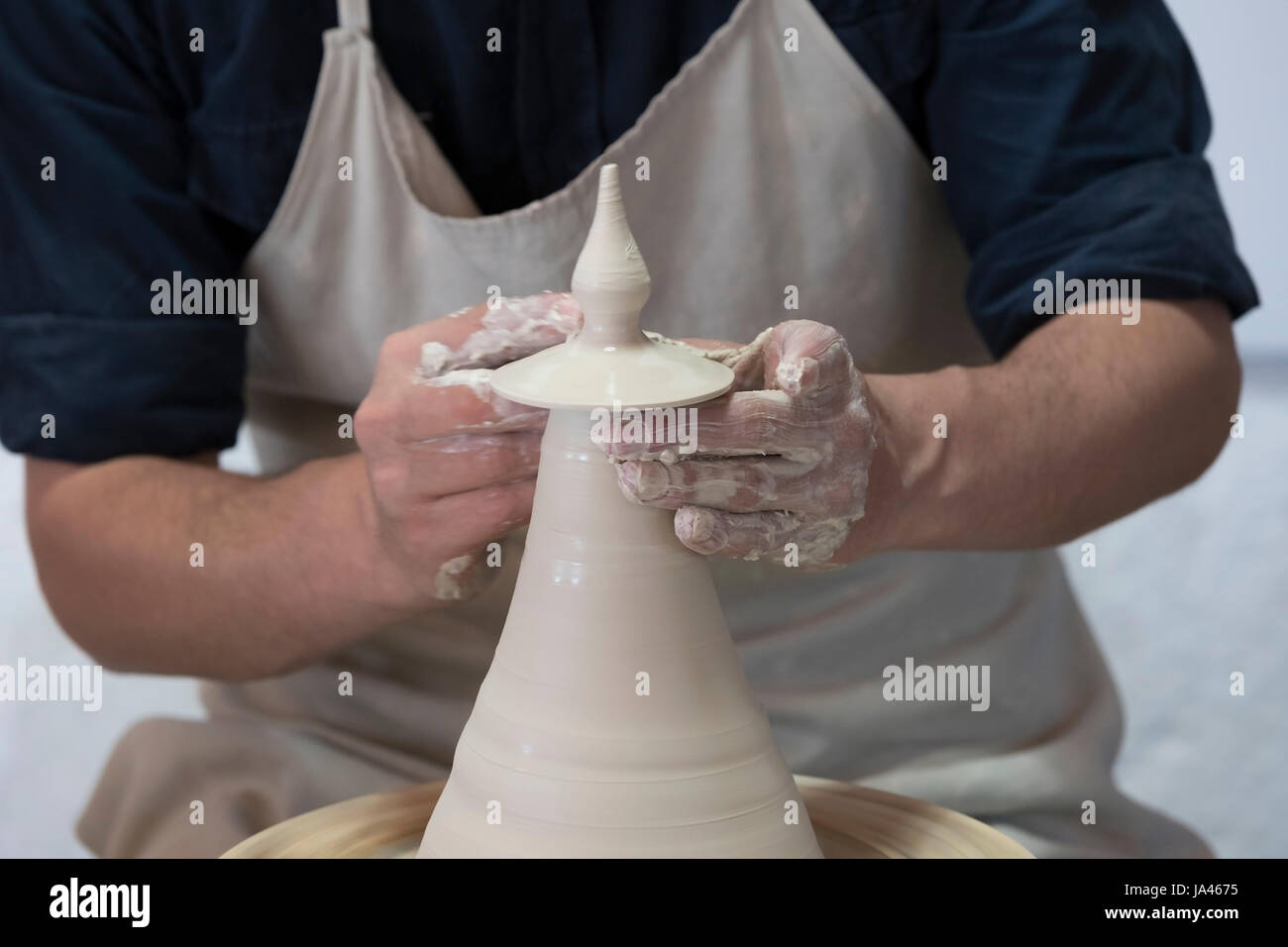 Potter makes pottery handmade in the workshop Stock Photo - Alamy