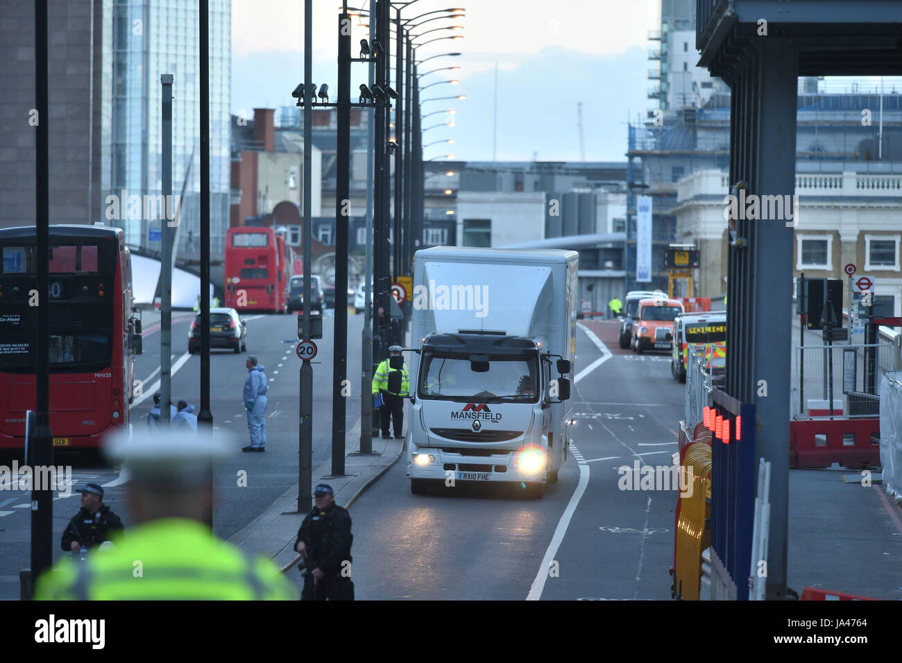 The van used in the attack is removed from the scene inside a lorry on ...