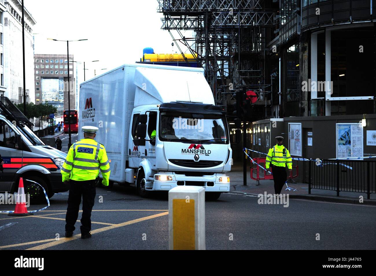 The van used in the attack is removed from the scene inside a lorry on ...
