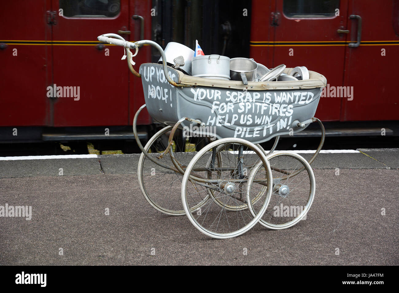 A pram full of pots and pans and message to collect scrap aluminium to ...