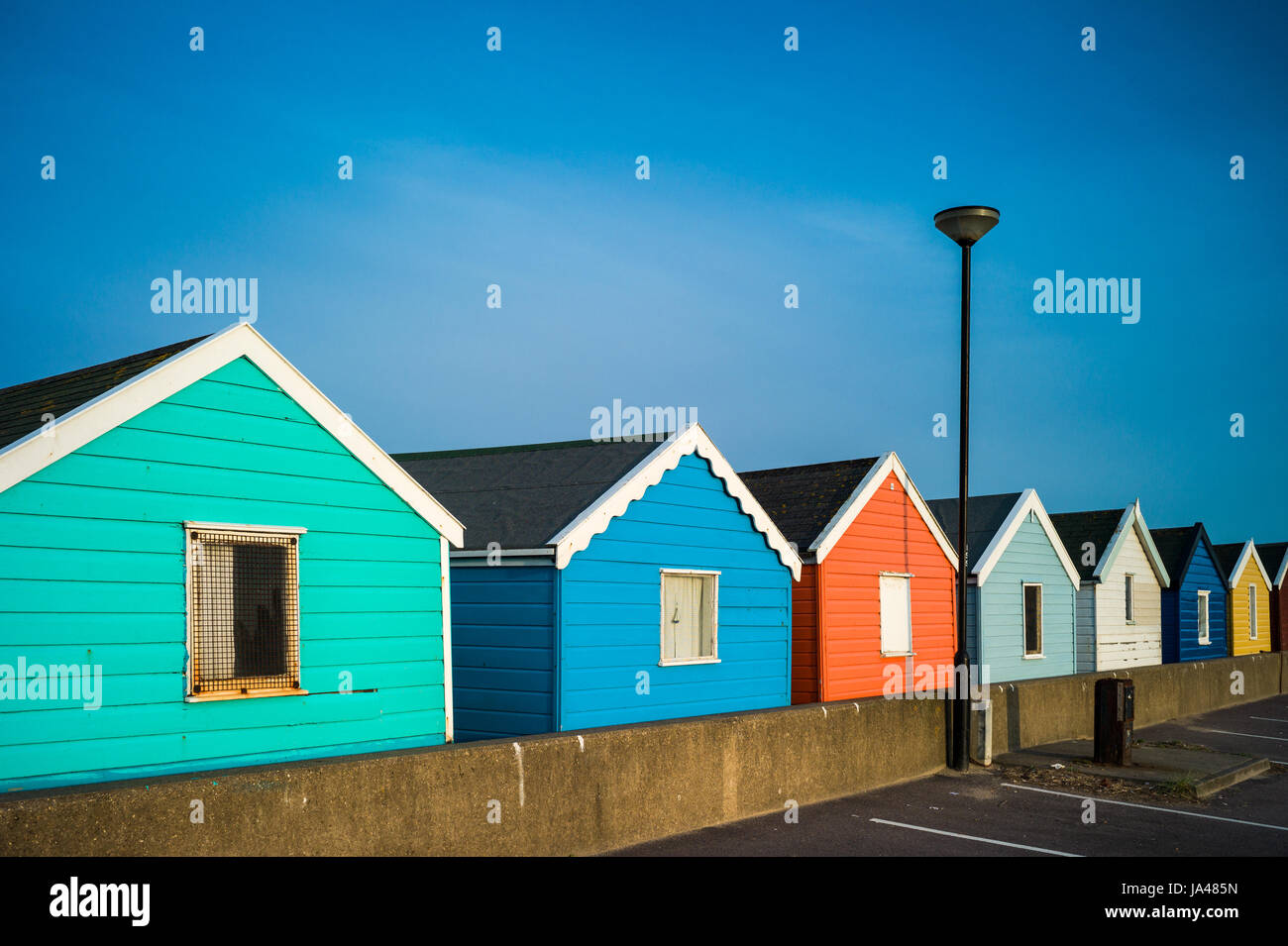 Colourful seaside beach huts in the small East Coast seaside resort of ...