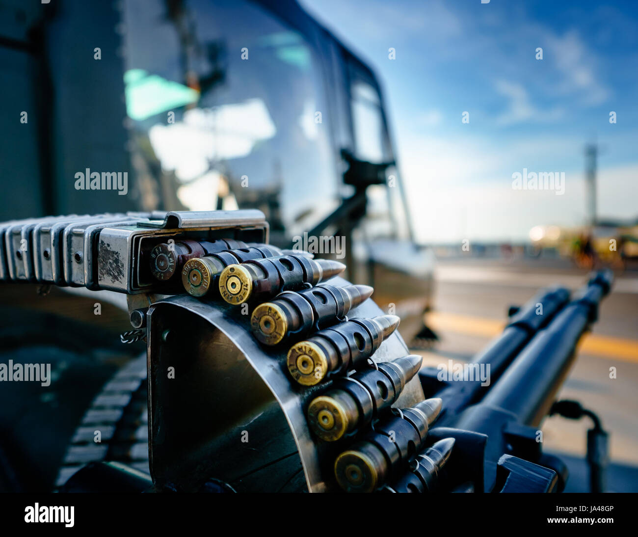 Large caliber bullets in belt up close. Defocused background of ...
