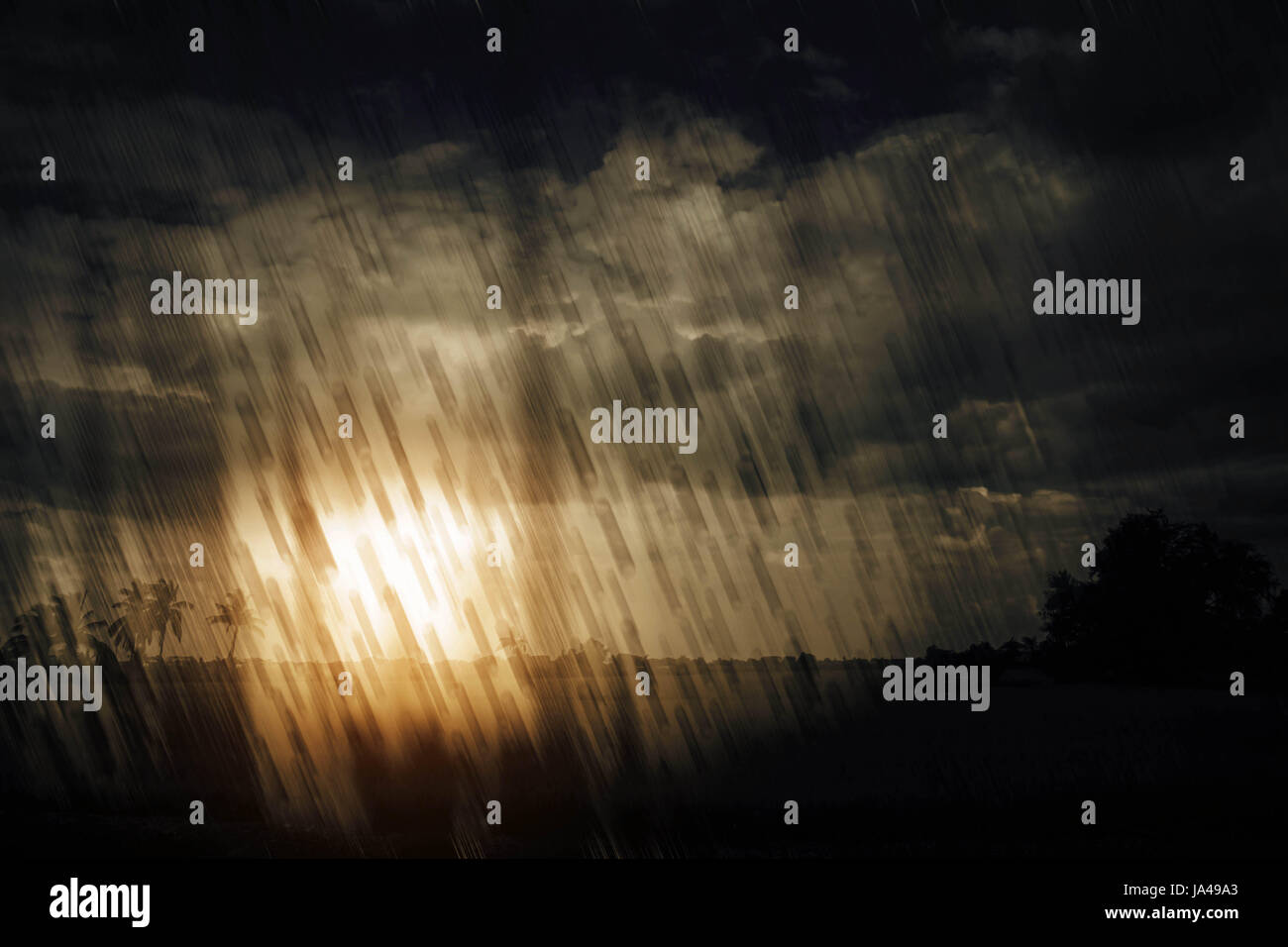 Rain in the fields with black silhouettes Stock Photo - Alamy