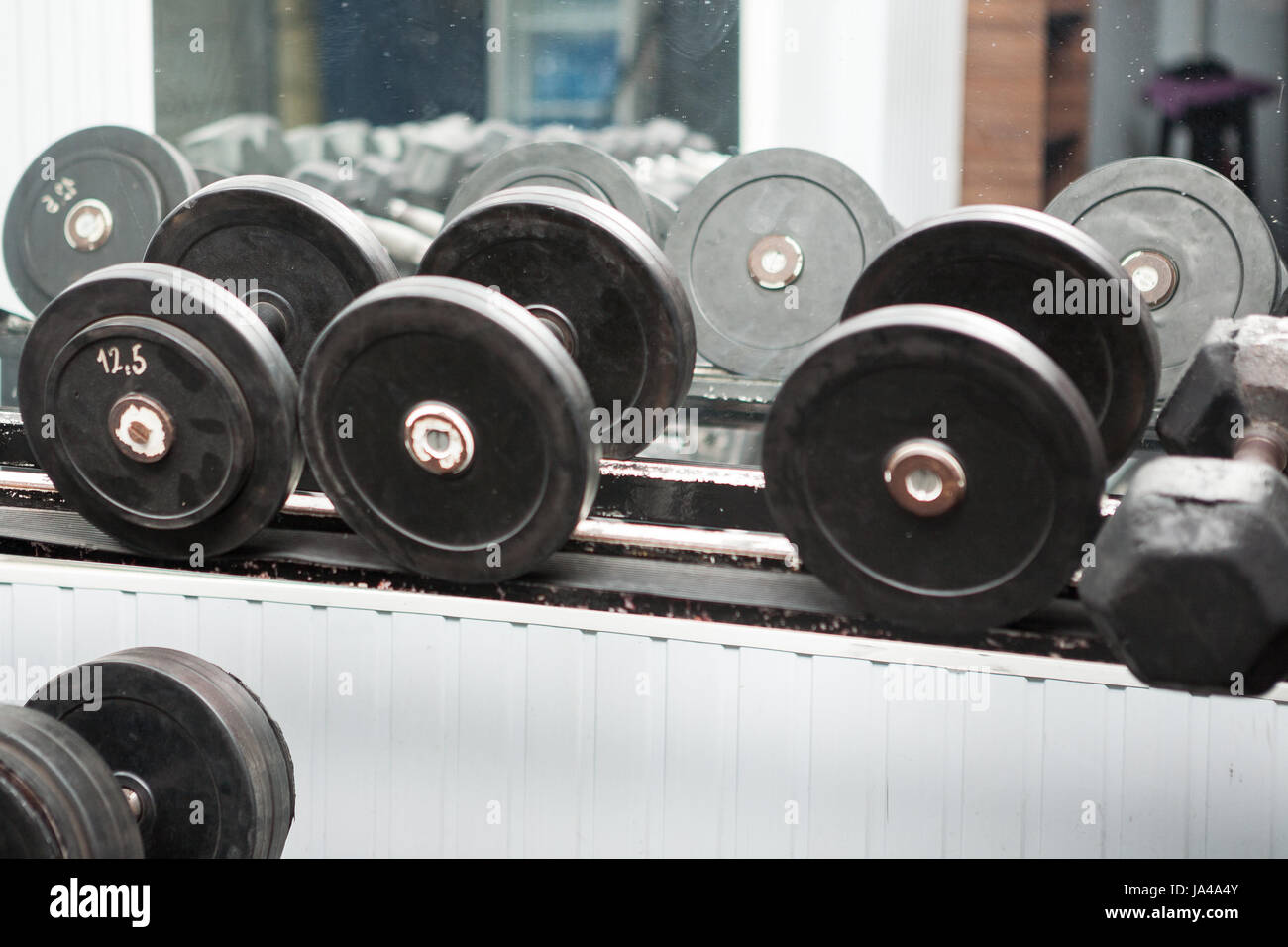 Fitness equipment in a gym. Workout and barbell Stock Photo - Alamy