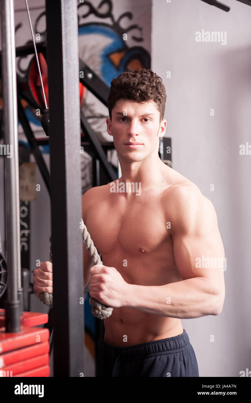 Strong man lifting weights in the gym. Lifting heavy weights ...