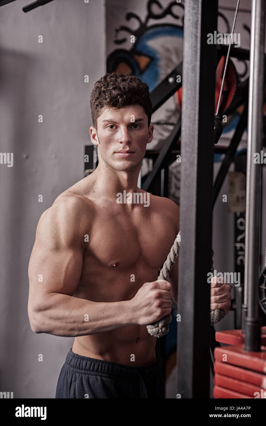 Strong man lifting weights in the gym. Lifting heavy weights ...