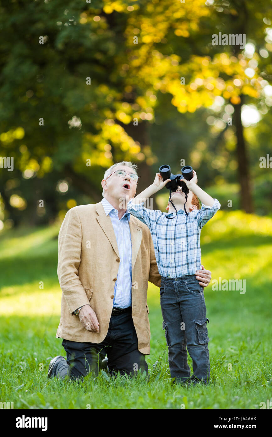 Grandfather and grandson in park Stock Photo - Alamy