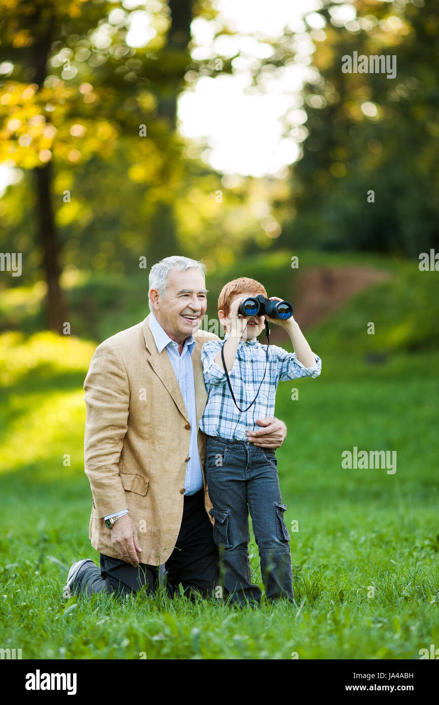 Grandfather and grandson in park Stock Photo - Alamy