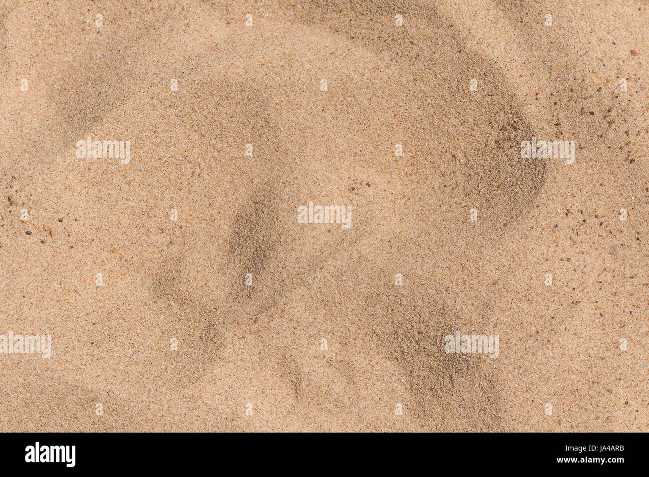 An abstract background of a sea sand and rock shapes. Shallow depth of ...