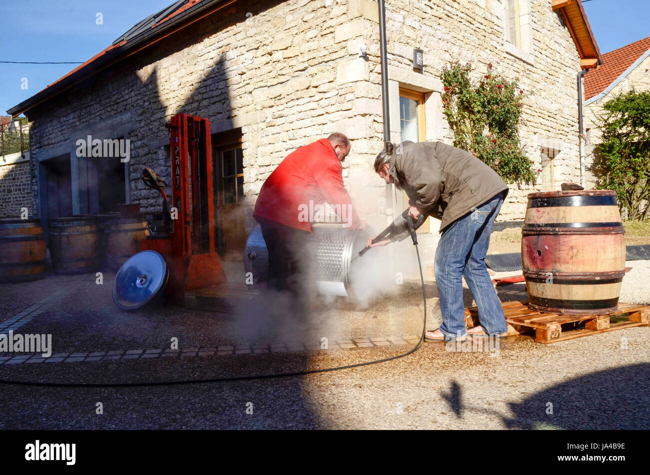 Men cleaning barrels with a water jet. Photographed in France Stock ...