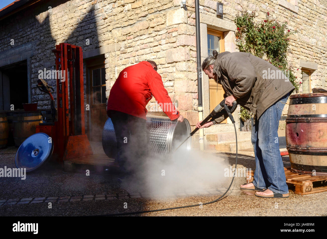 Men cleaning barrels with a water jet. Photographed in France Stock ...