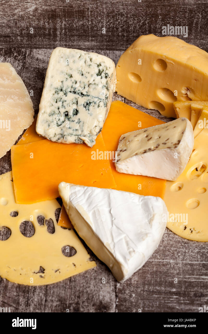 Mix of different type of cheese on wooden background. Healthy food ...