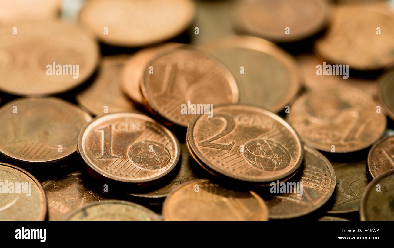 background full of Euro cents, copper coin, one and two cents coin wil ...