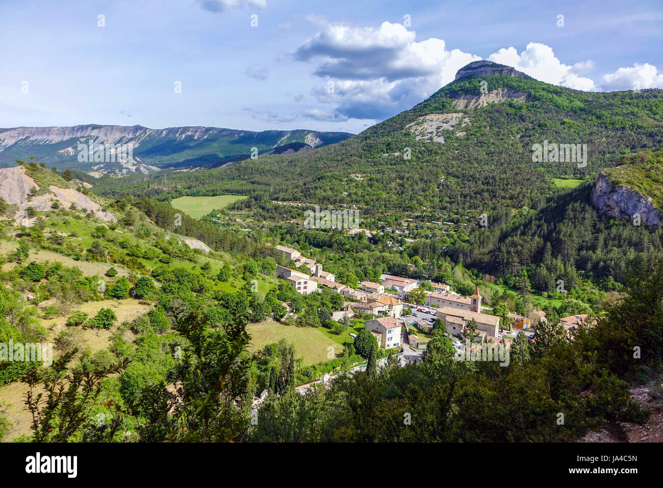 The village of Orpierre surrounded by hills, Provence, South of France ...