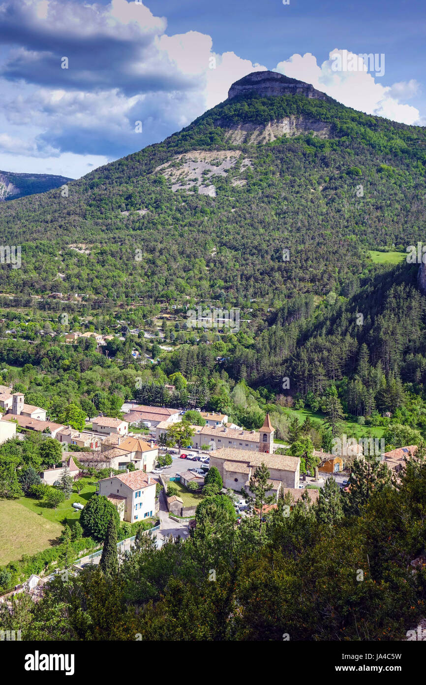The village of Orpierre surrounded by hills, Provence, South of France ...