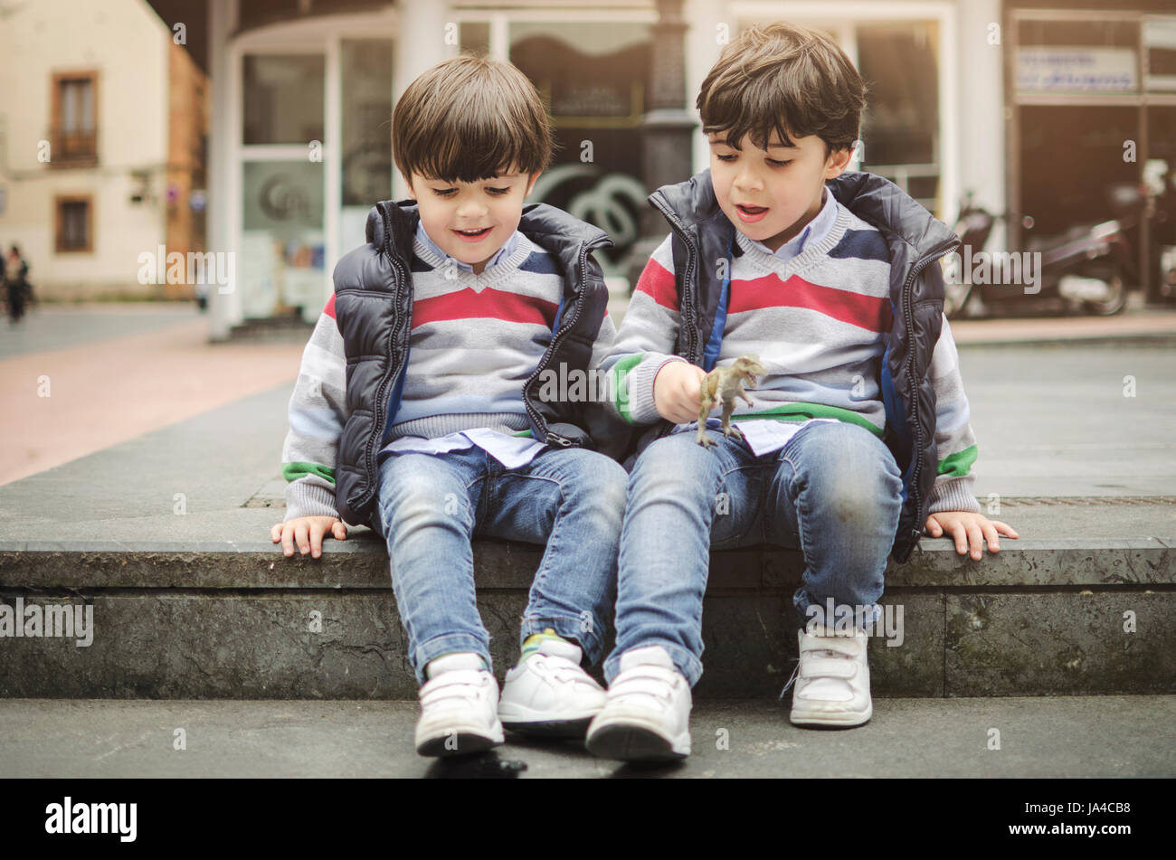 Twin brothers playing Stock Photo - Alamy