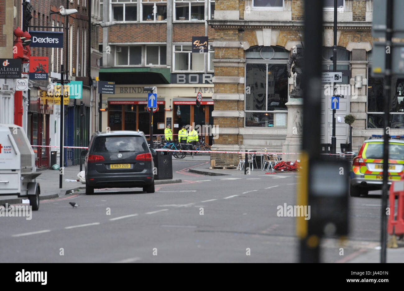 Police officers outside Borough Market following Saturday's terrorist ...