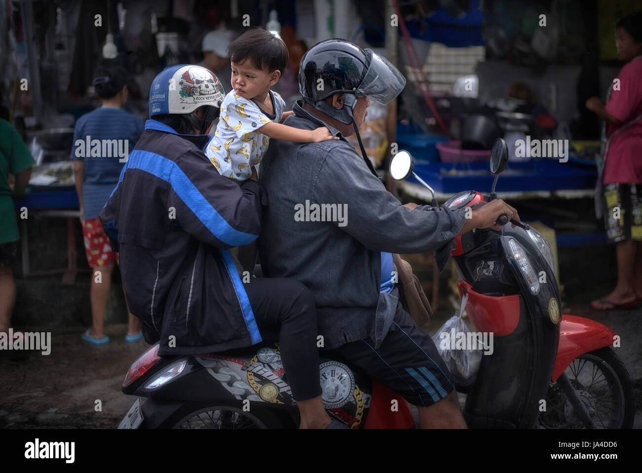 Child motorcycle. Thailand parents carrying their young child on a ...