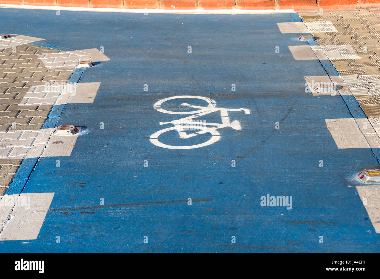 Marking on the bike lane and traffic signs Stock Photo - Alamy